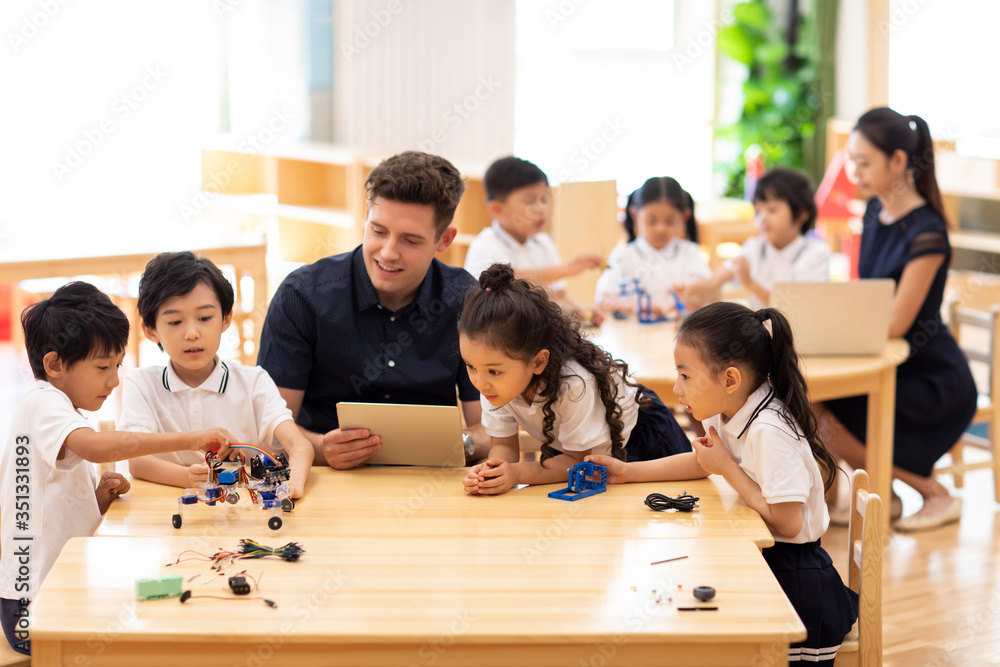 Children learning coding in classroom Stock Photo | Adobe Stock
