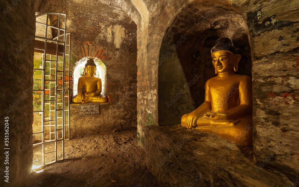 Buddha statues in the underground brick-lined corridors of Htukkant ...