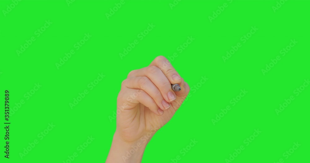 Human female hand writing something fast. Daylight. Green screen ...