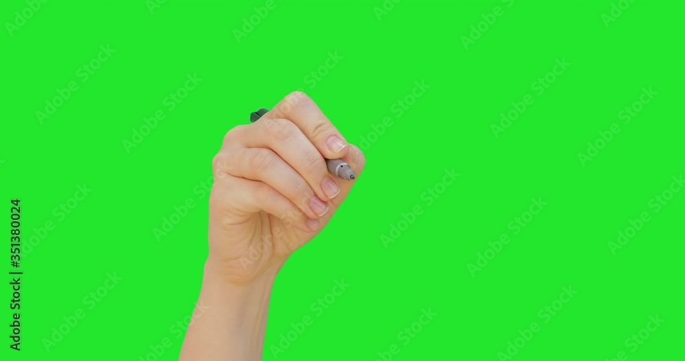 Human female hand writing something. Daylight. Green screen background ...