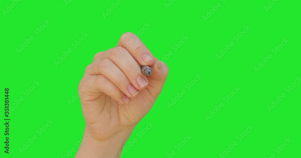 Human female hand writing something. Daylight. Green screen background ...