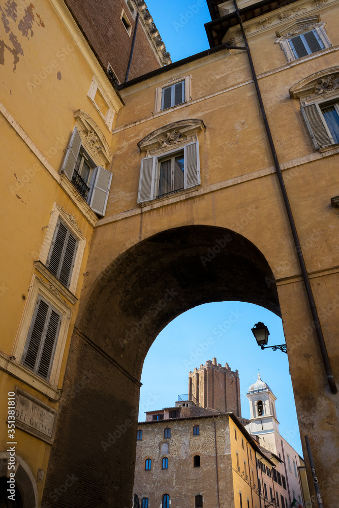 Rome, Italy: view of Milizie tower from the arch of Salita del Grillo ...
