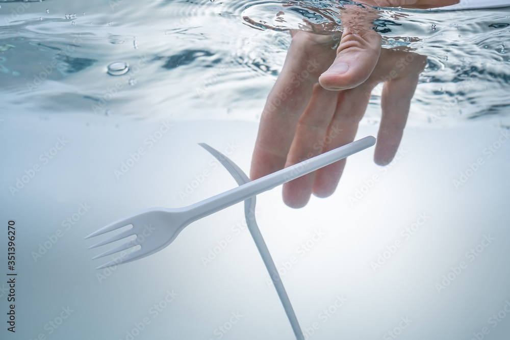 Ecological problem of water pollution, the environment. Hand pulling ...