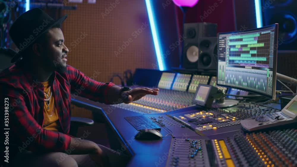 Stylish Audio Engineer Working in Music Recording Studio, Uses Mixing ...