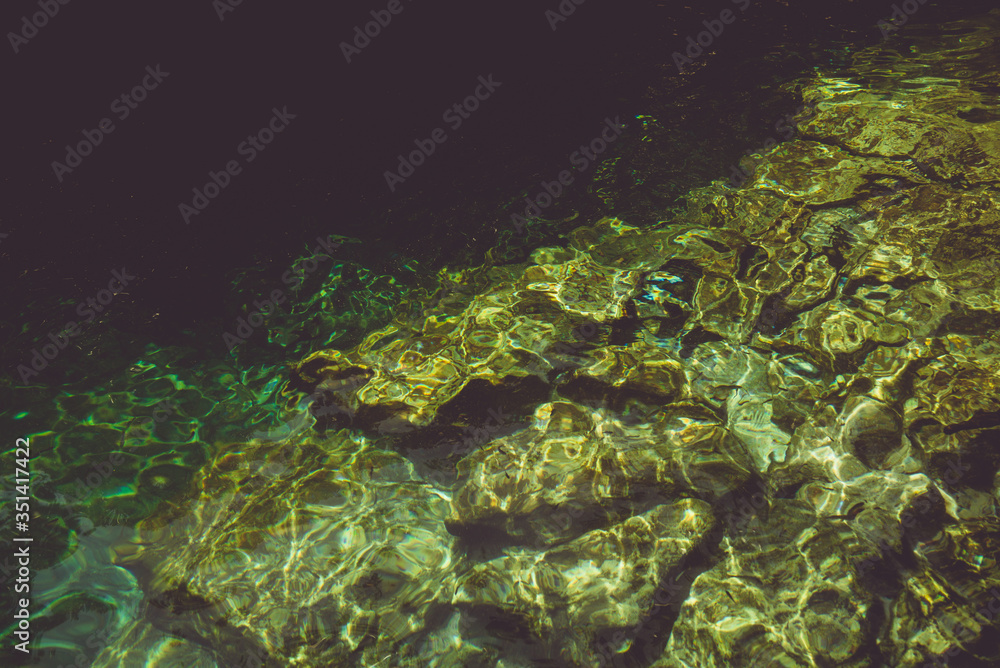 A cenote is a natural pit, or sinkhole, resulting from the collapse of ...