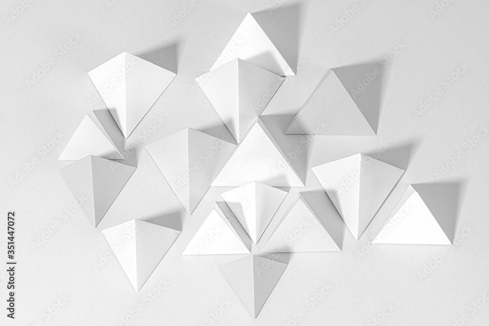 3D gray pyramid paper craft on a gray background Stock Photo | Adobe Stock