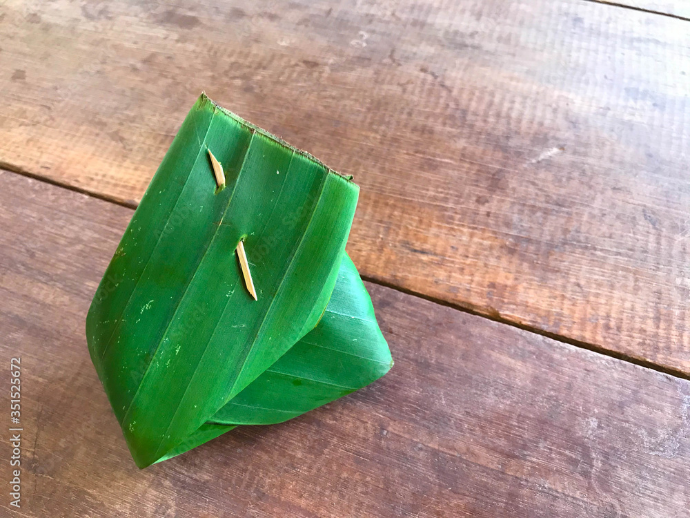 'Khao Niao Sangkhaya' Thai dessert sticky rice with egg custard wrapped ...