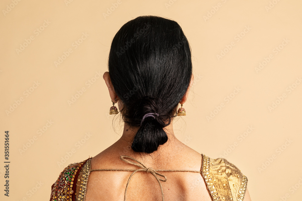 Rear view of an Indian woman in a traditional saree Stock Photo | Adobe ...