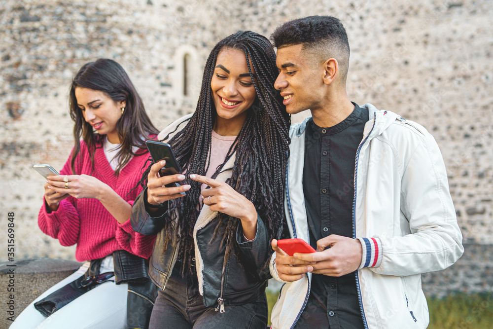 Gen Z friends using smartphones and social networks together, having ...