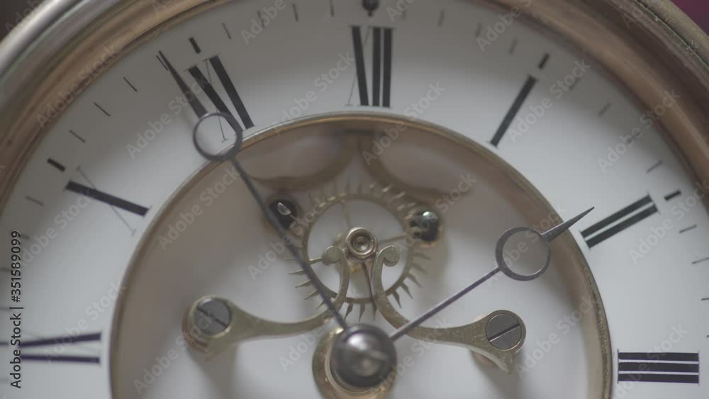 Macro shot of an antique vintage clock with a detailed depiction of the ...