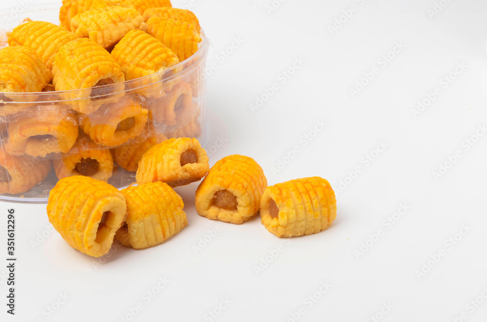 Pineapple roll tart cookies known as Tat Nenas isolated on white ...