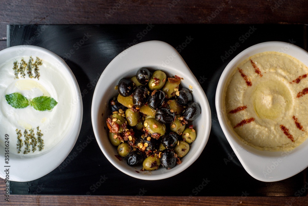 Cold Arabic Breakfast, hummus, labneh, olives, Arabic appetizers, mezze ...