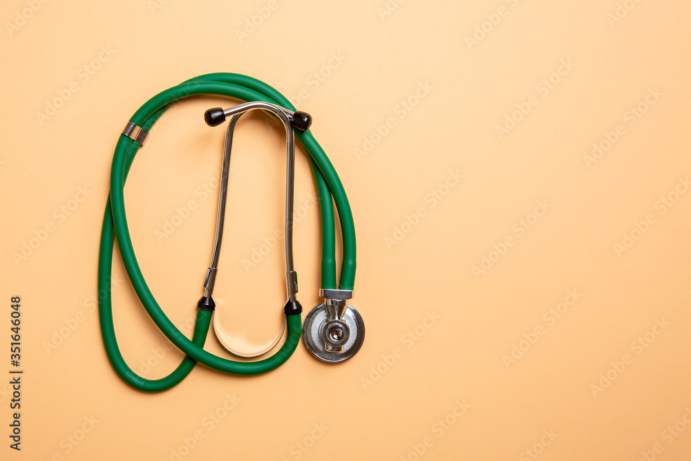 Top view of green stethoscope on colorful background. Medical diagnosis ...
