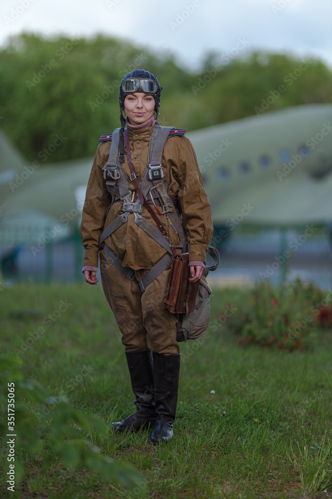 A young female pilot in uniform of Soviet Army pilots during the World ...