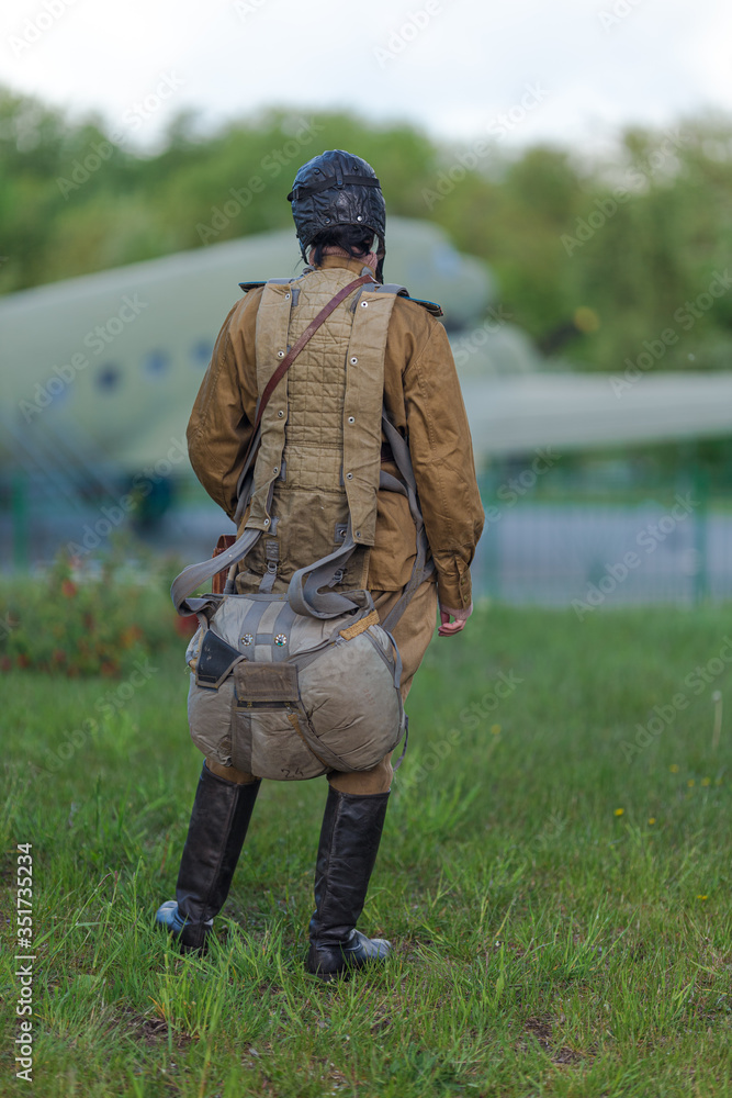 A young female pilot in uniform of Soviet Army pilots during the World ...
