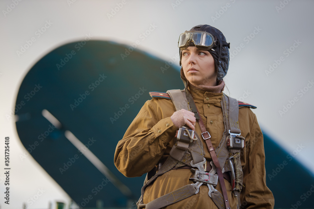 A young female pilot in uniform of Soviet Army pilots during the World ...