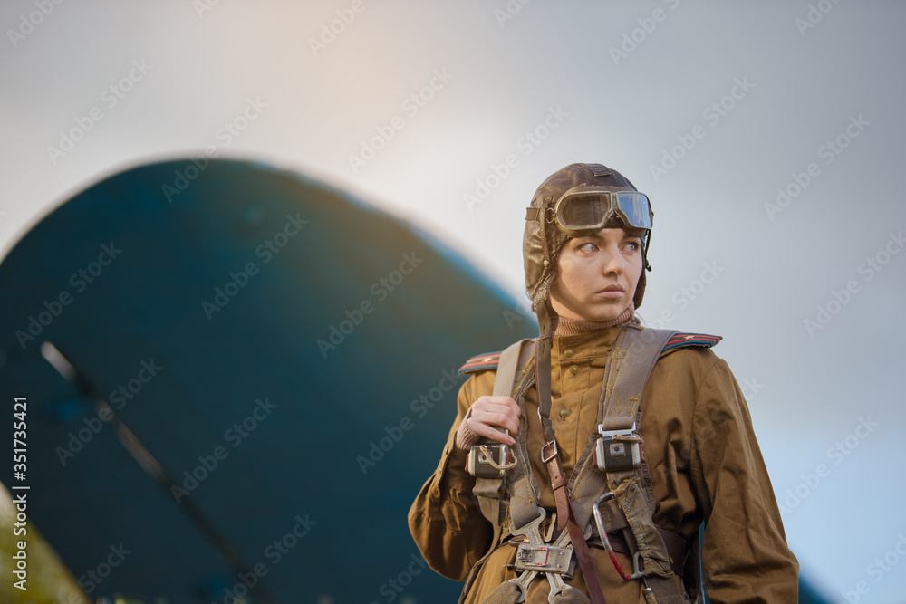 A young female pilot in uniform of Soviet Army pilots during the World ...