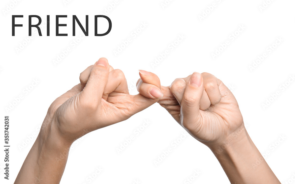 Woman showing word Friend on white background, closeup. American sign ...
