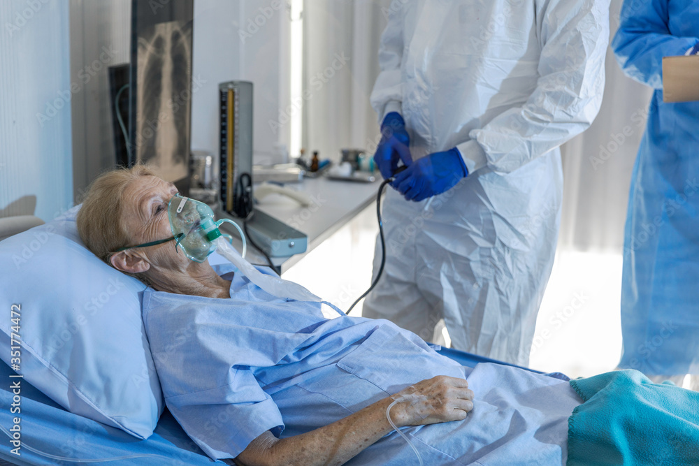 Old female Caucasian patient infected with virus receives oxygen ...