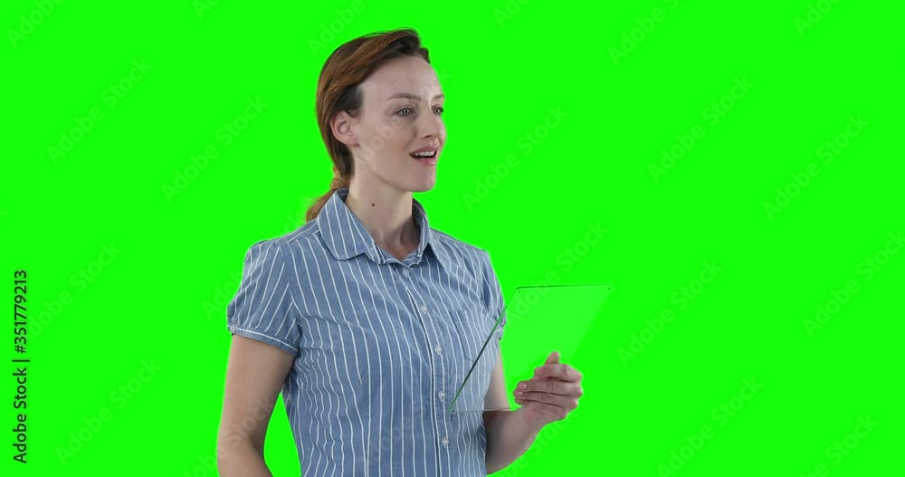 woman holding a transparent screen on green background Stock Video ...