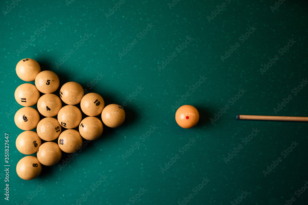 Billiard balls and cue on the billiard table, top view, flat lay Stock ...