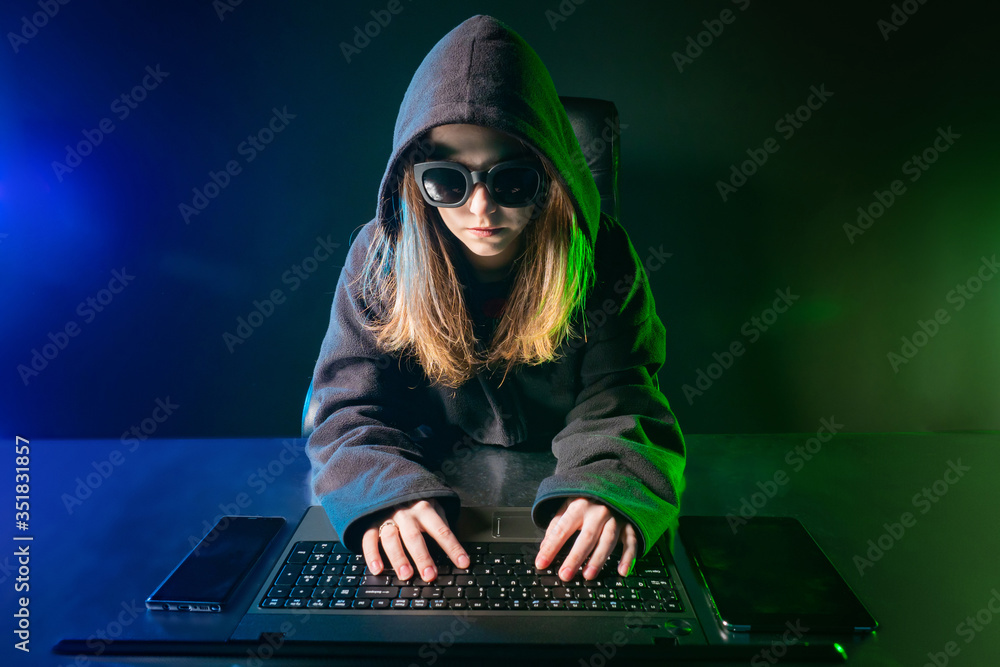 The girl hacker. Cybercrime. The girl breaks into a computer program ...