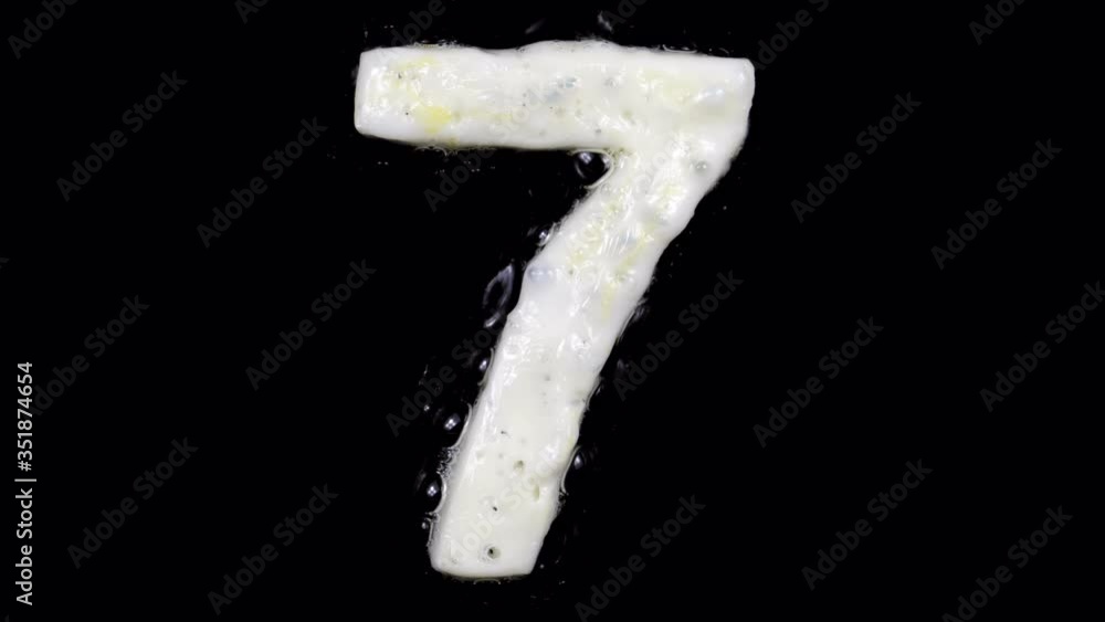 Egg white frying number seven, 7, top view, include two looped 10 ...