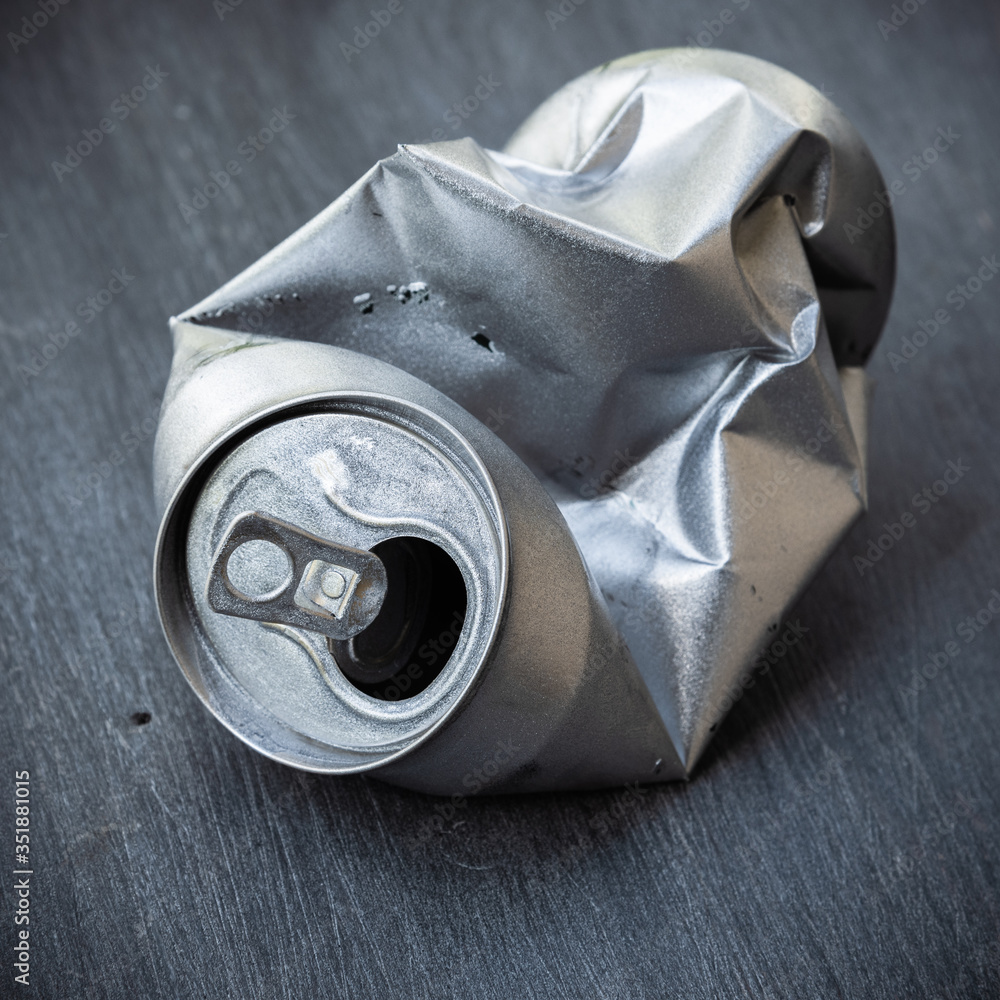 Crumpled aluminum silver can from under the drink close up - concept of ...