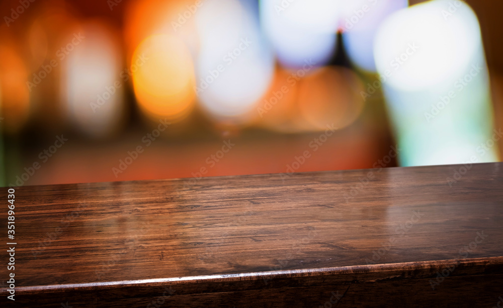 bar nightclub background.Empty diagonal brown wooden table with blur ...