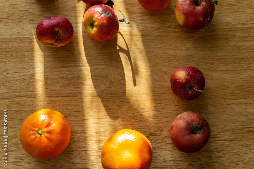 Bright juicy fruits, natural and natural fruits with damage. Red apples ...