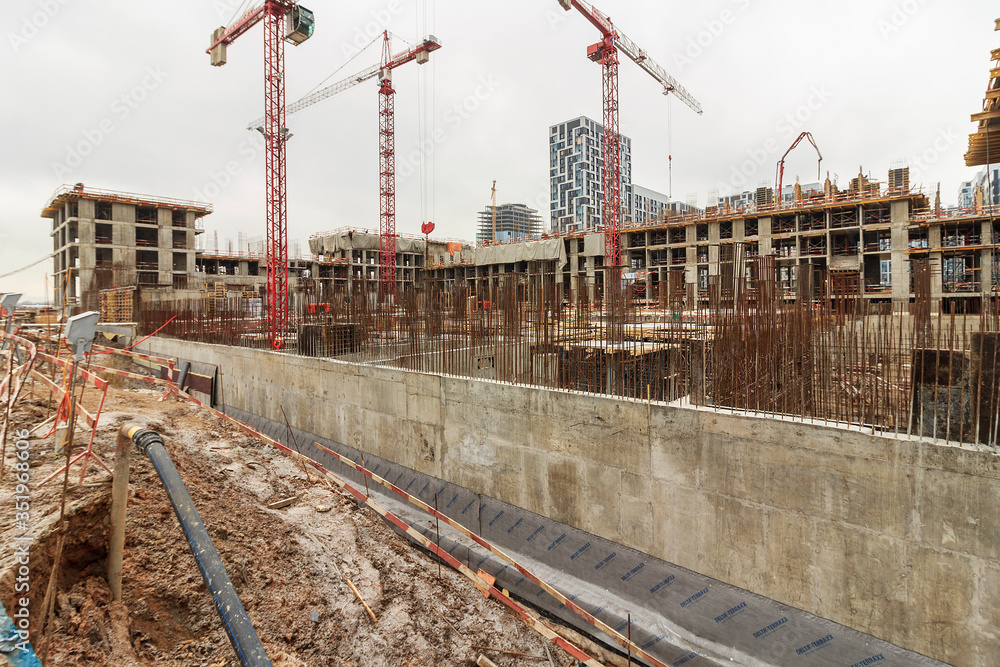 Pile driving in foundation pit for construction of apartment building ...