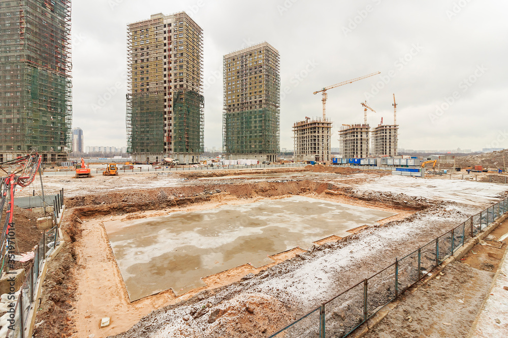 Pile driving in foundation pit for construction of apartment building ...