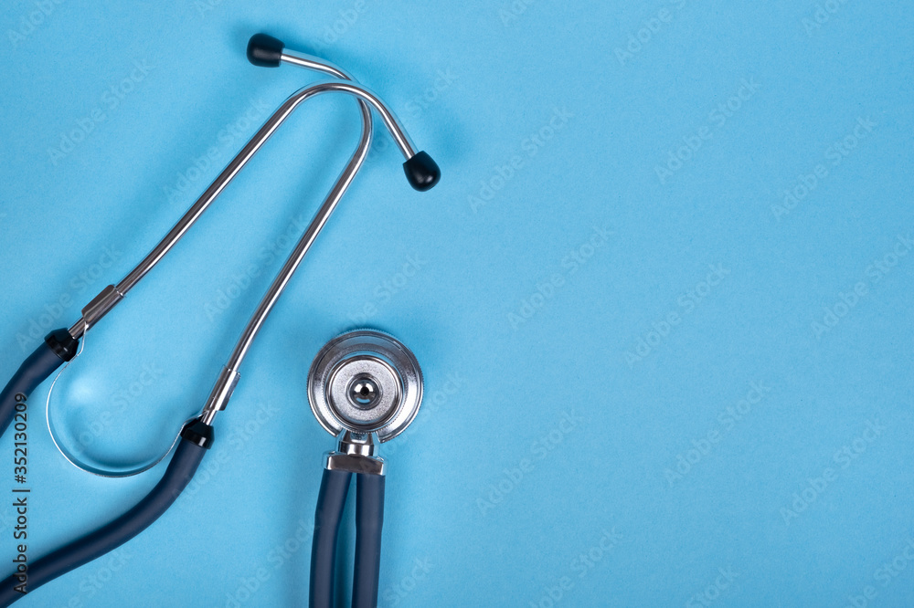 Stethoscope on a light blue background. Health care and surgical ...