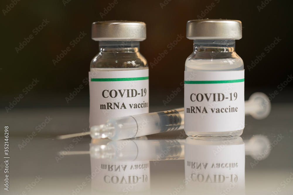 COVID-19 mRNA Vaccine and syringe with needle injection. It use for ...