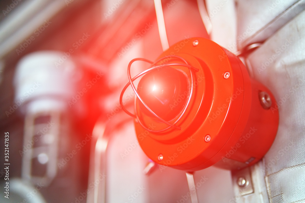 Fire alarm with red warning light of an emergency beacon at an ...