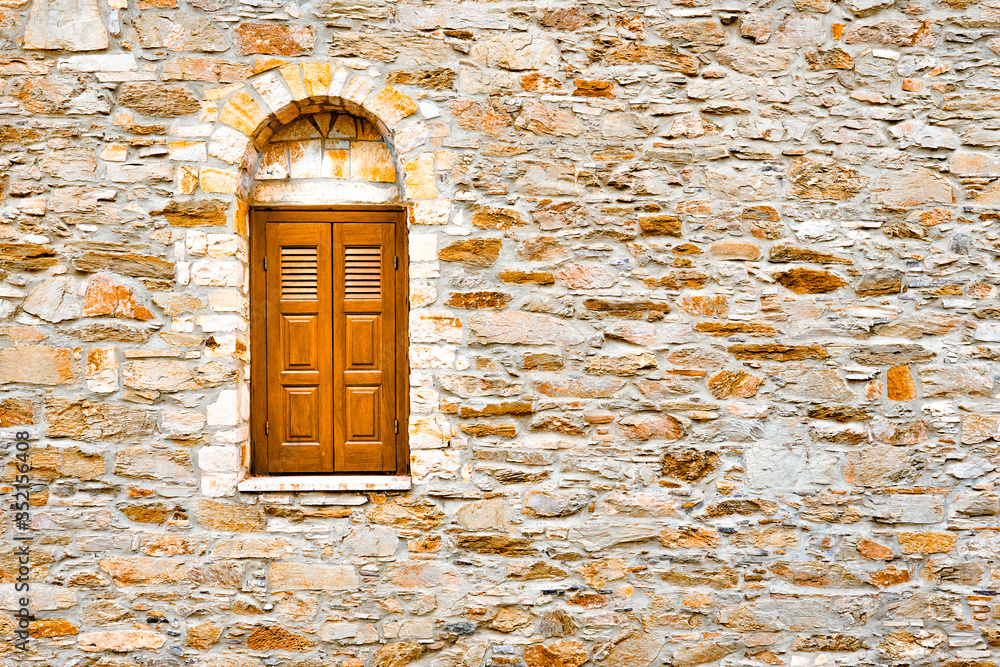Arch window with stone wall. Wall with window background. Surface with ...