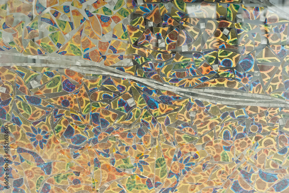 Window texture with stained glass. The glass is covered with colorful ...
