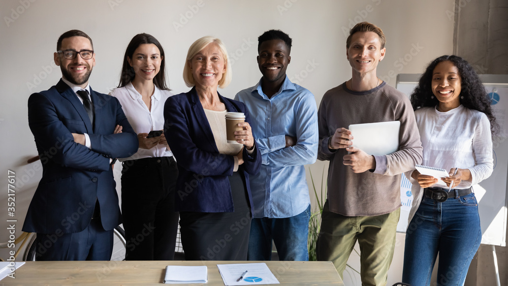 Smiling diverse employees posing for corporate portrait in office ...
