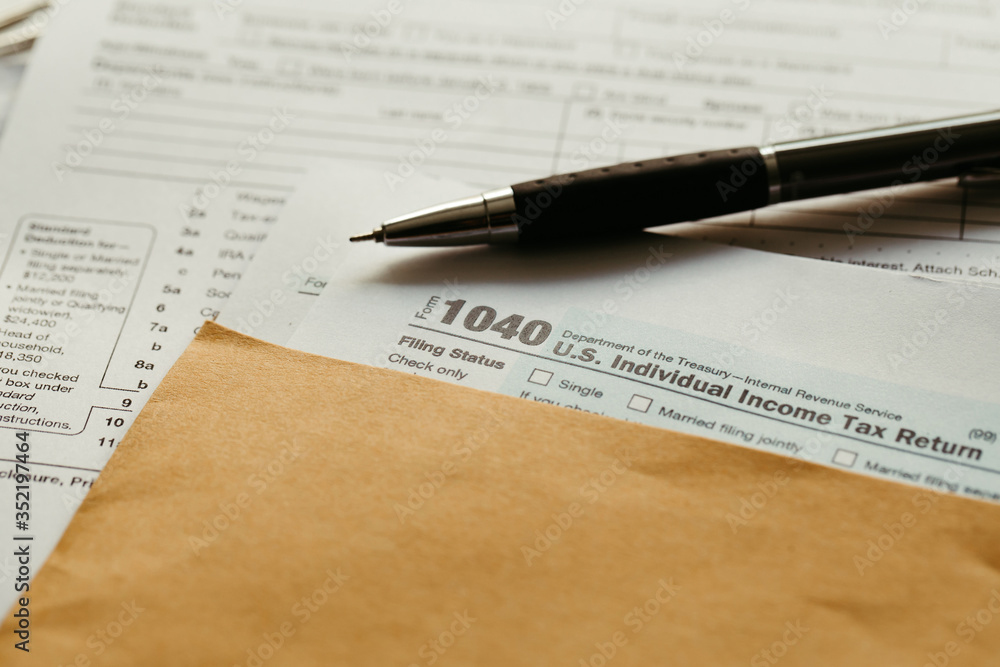 Individual income tax return form, income tax return form and pen on ...