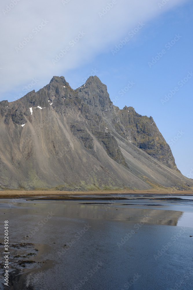Icelands Vestraborn and Brunnhorn mountain rise out of the ocean oand ...