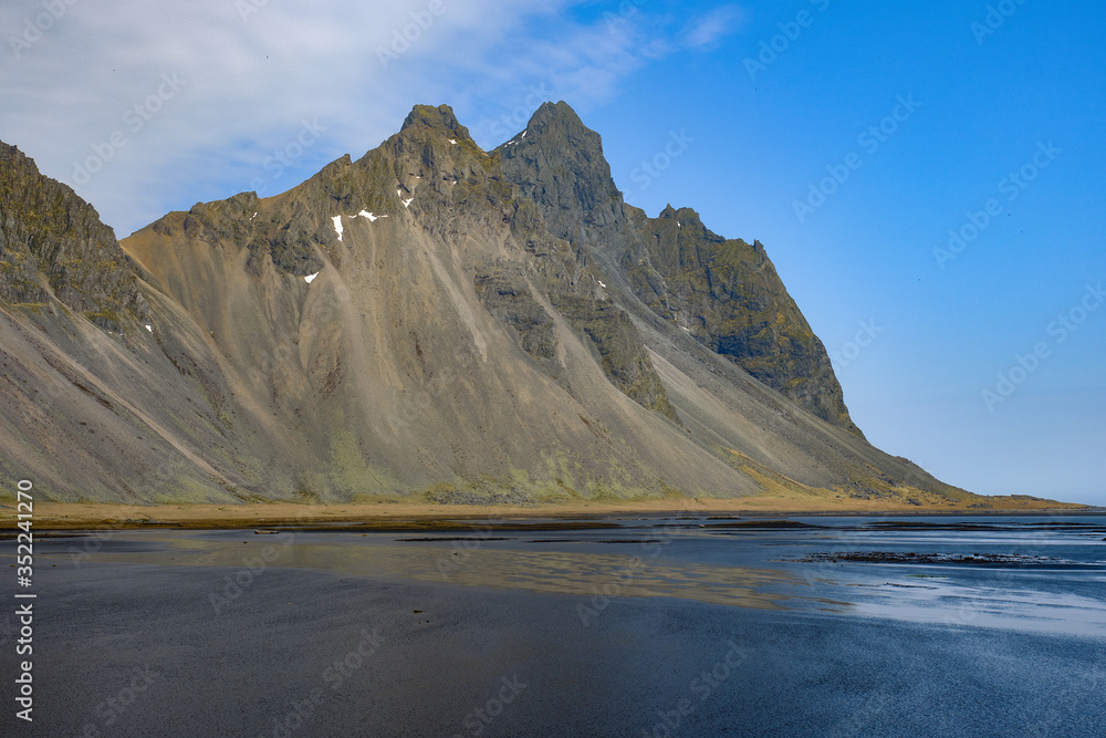 Icelands Vestraborn and Brunnhorn mountain rise out of the ocean oand ...