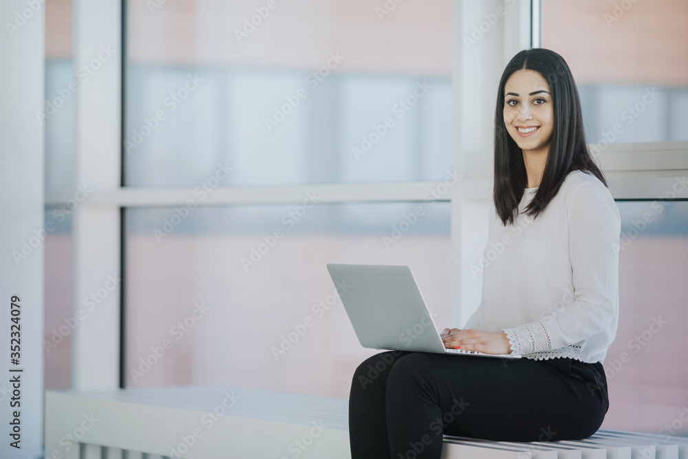 Elegant HR employee working on a laptop waiting for an internship ...