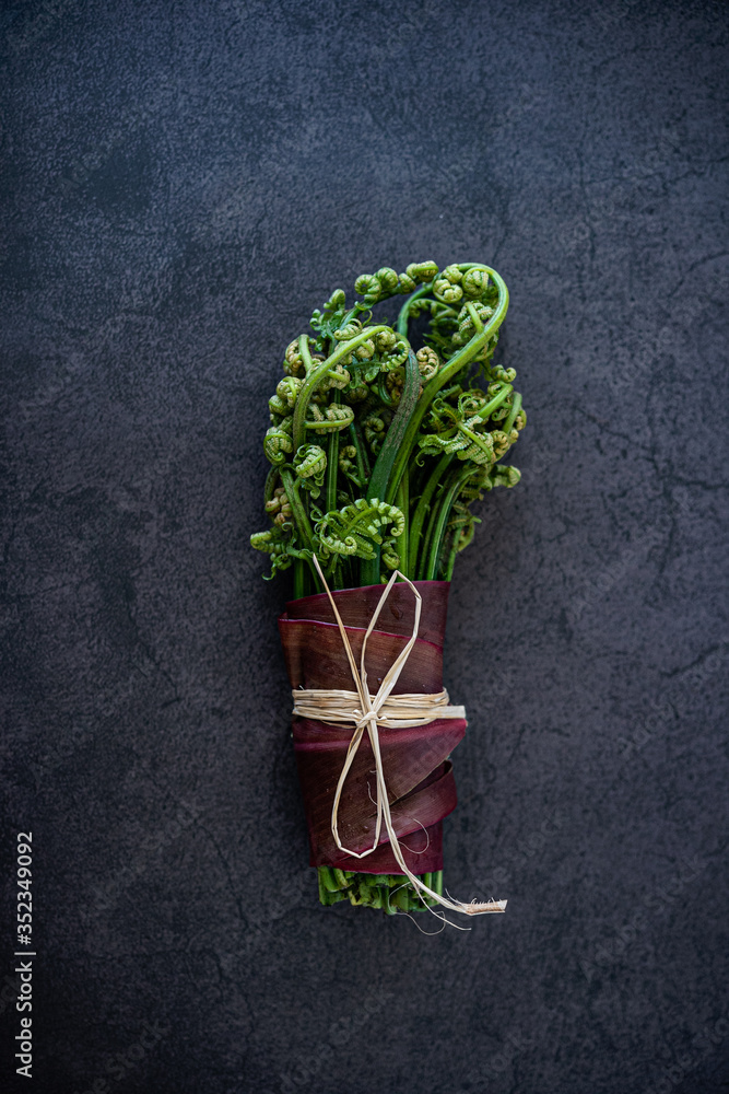 A bunch of Pohole, Edible Fern, Hawaii Local Food with dark, black ...
