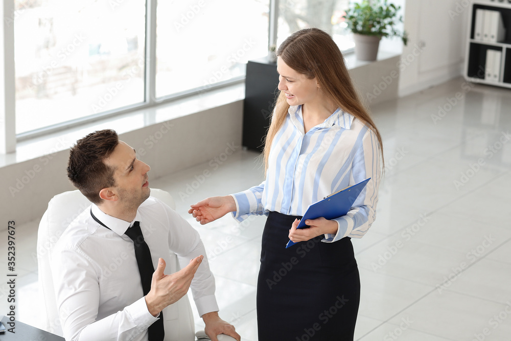Boss and his beautiful secretary working in office Stock Photo | Adobe ...