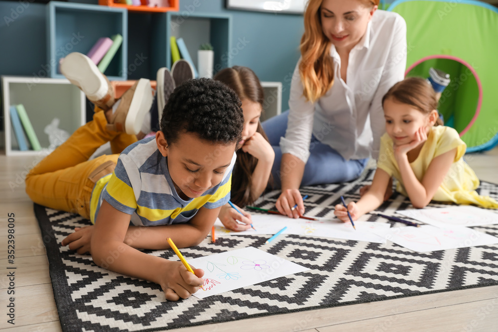 Cute children drawing at school Stock Photo | Adobe Stock