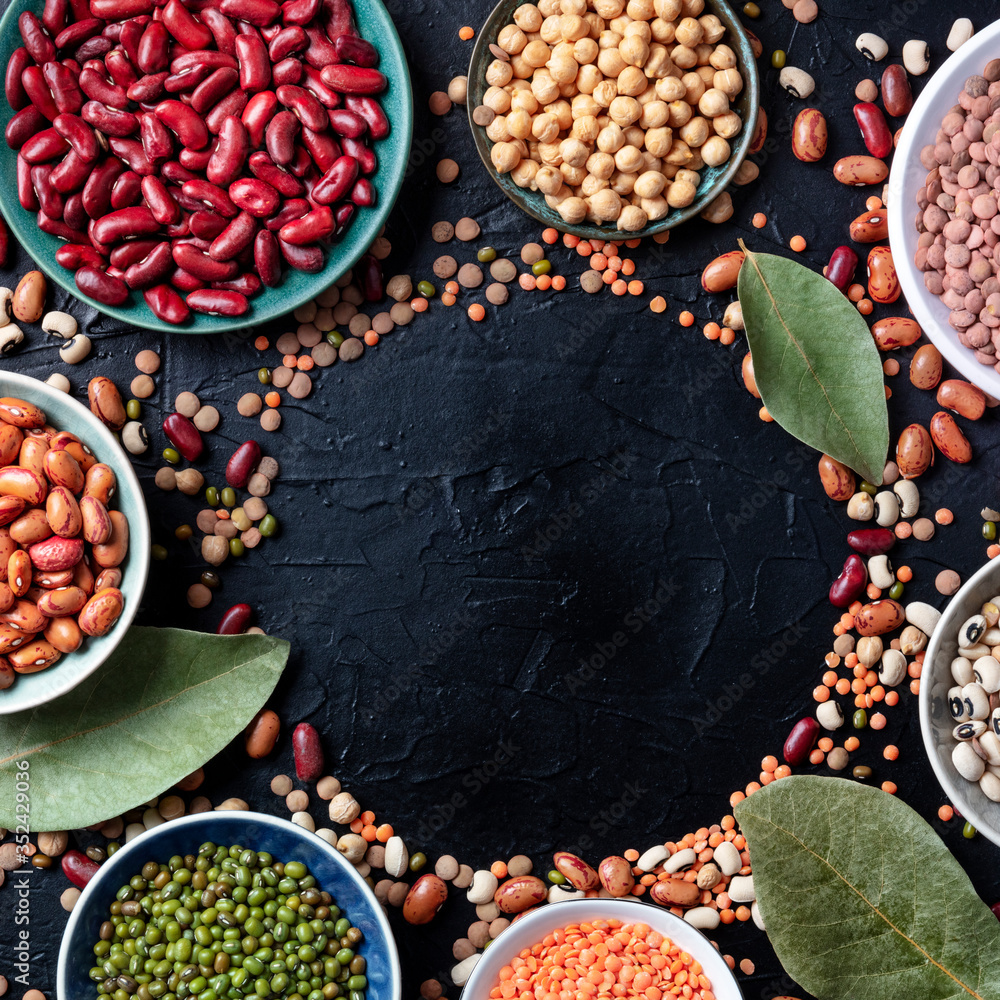 Legumes, top shot on a dark background with copy space. Lentils ...
