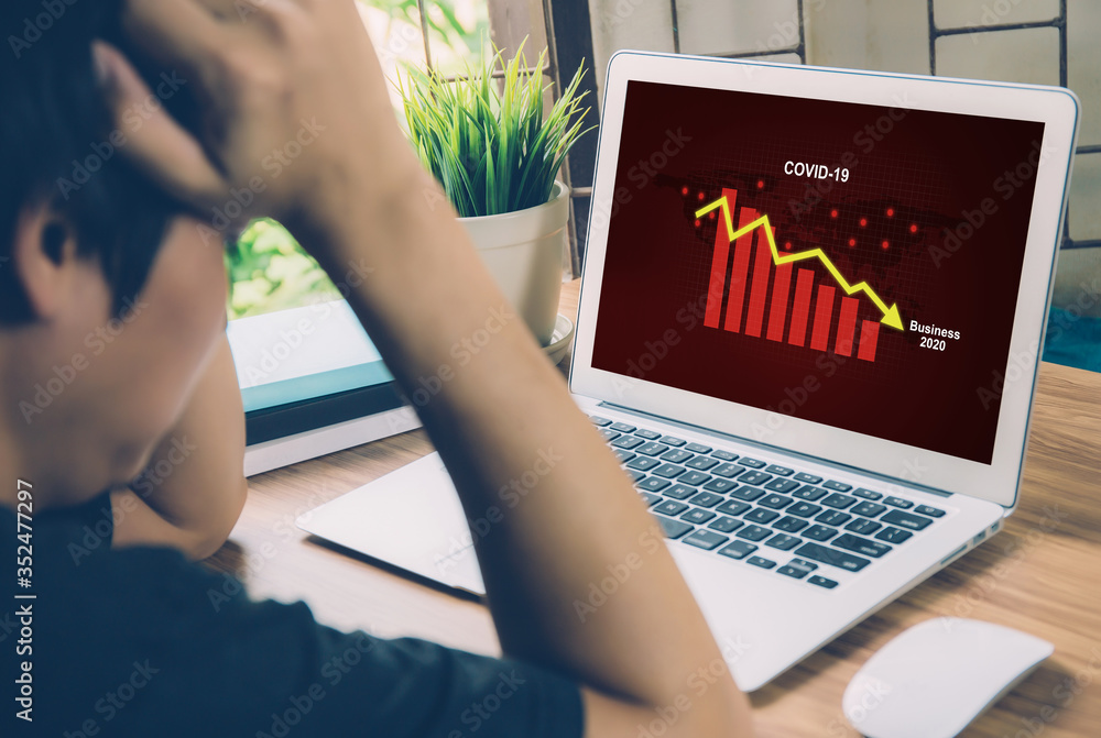Businessman panic about financial of business with graph chart and ...
