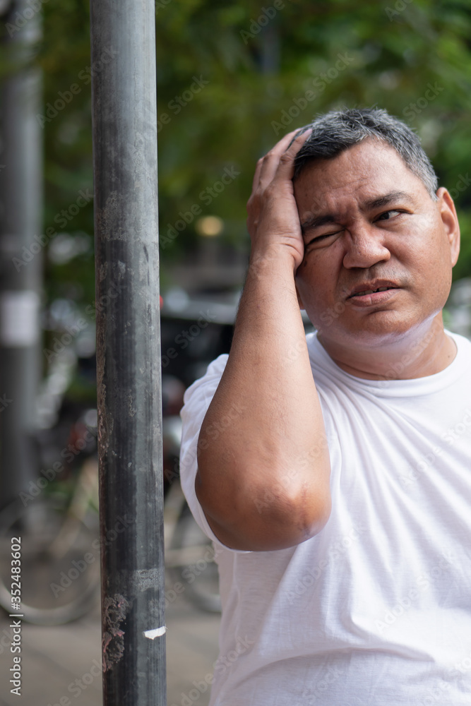 unlucky careless old senior man hitting his head with iron pole ...