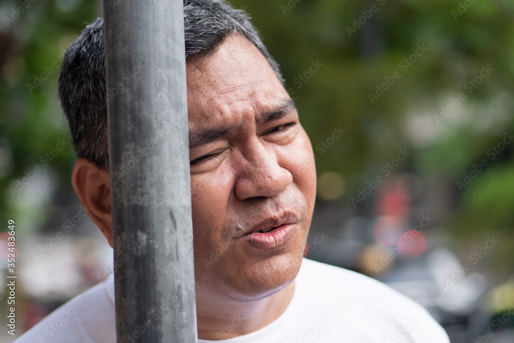 unlucky careless old senior man hitting his head with iron pole ...