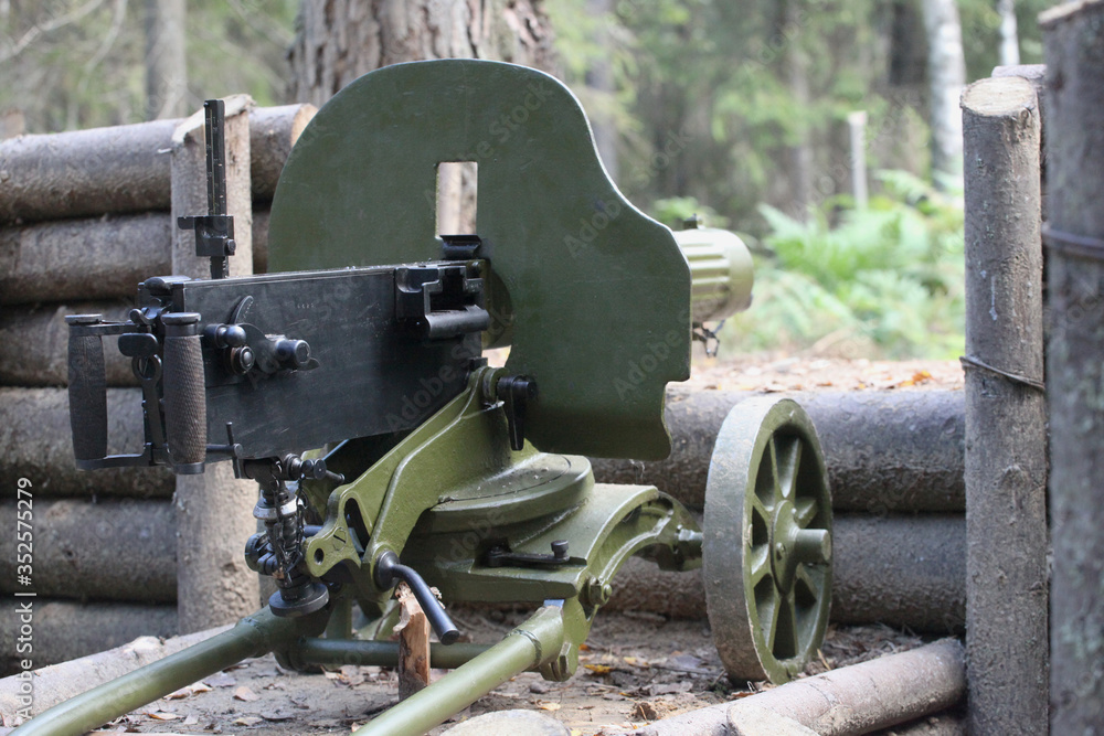 Maxim machine gun in a wooden dugout in the forest, a world war II ...